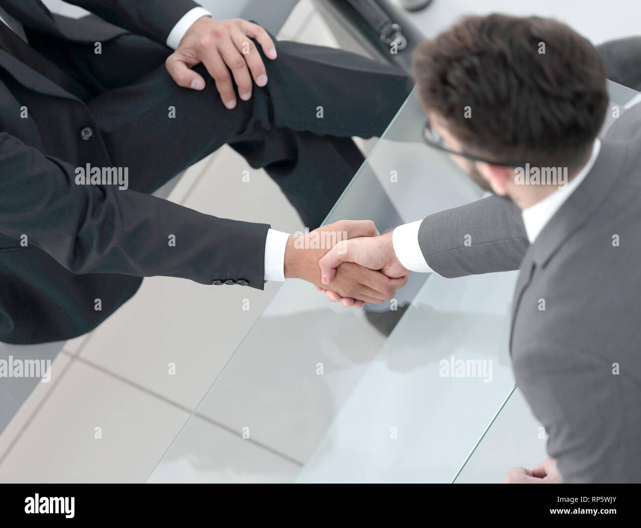 handshake Manager and the client in the office Stock Photo - Alamy