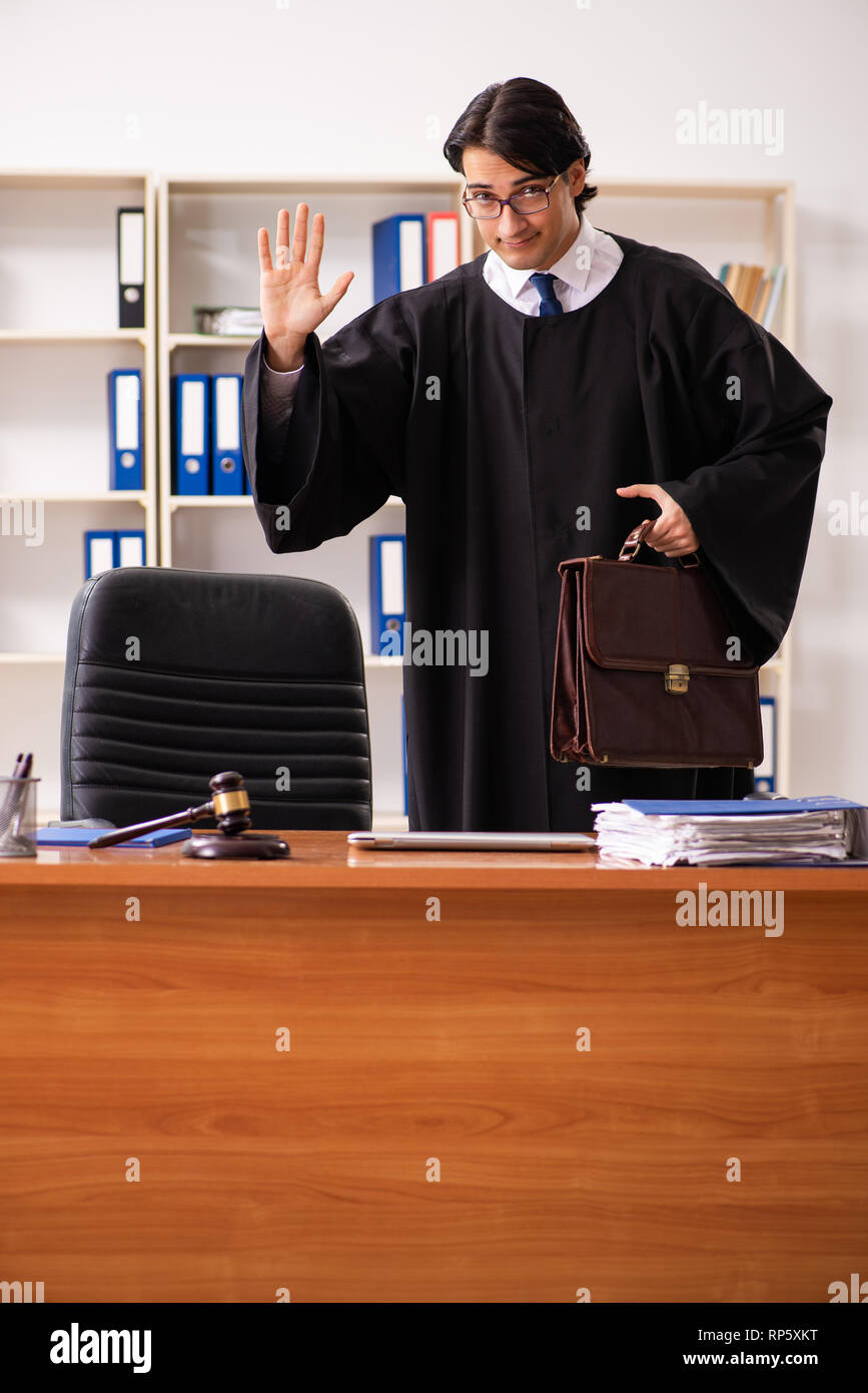 Young handsome judge working in court Stock Photo - Alamy