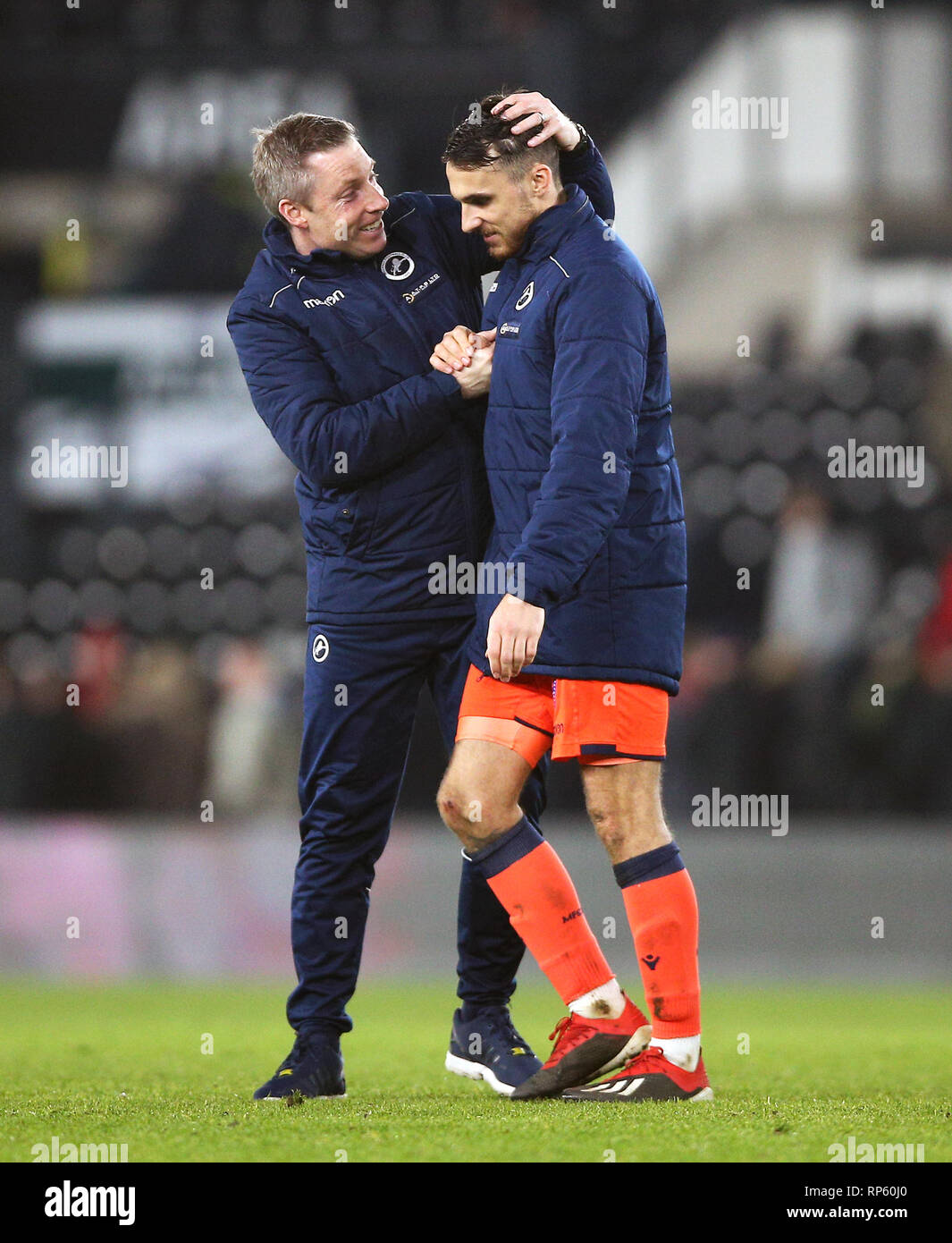 Millwall manager Neil Harris (left) celebrates victory after the Sky ...