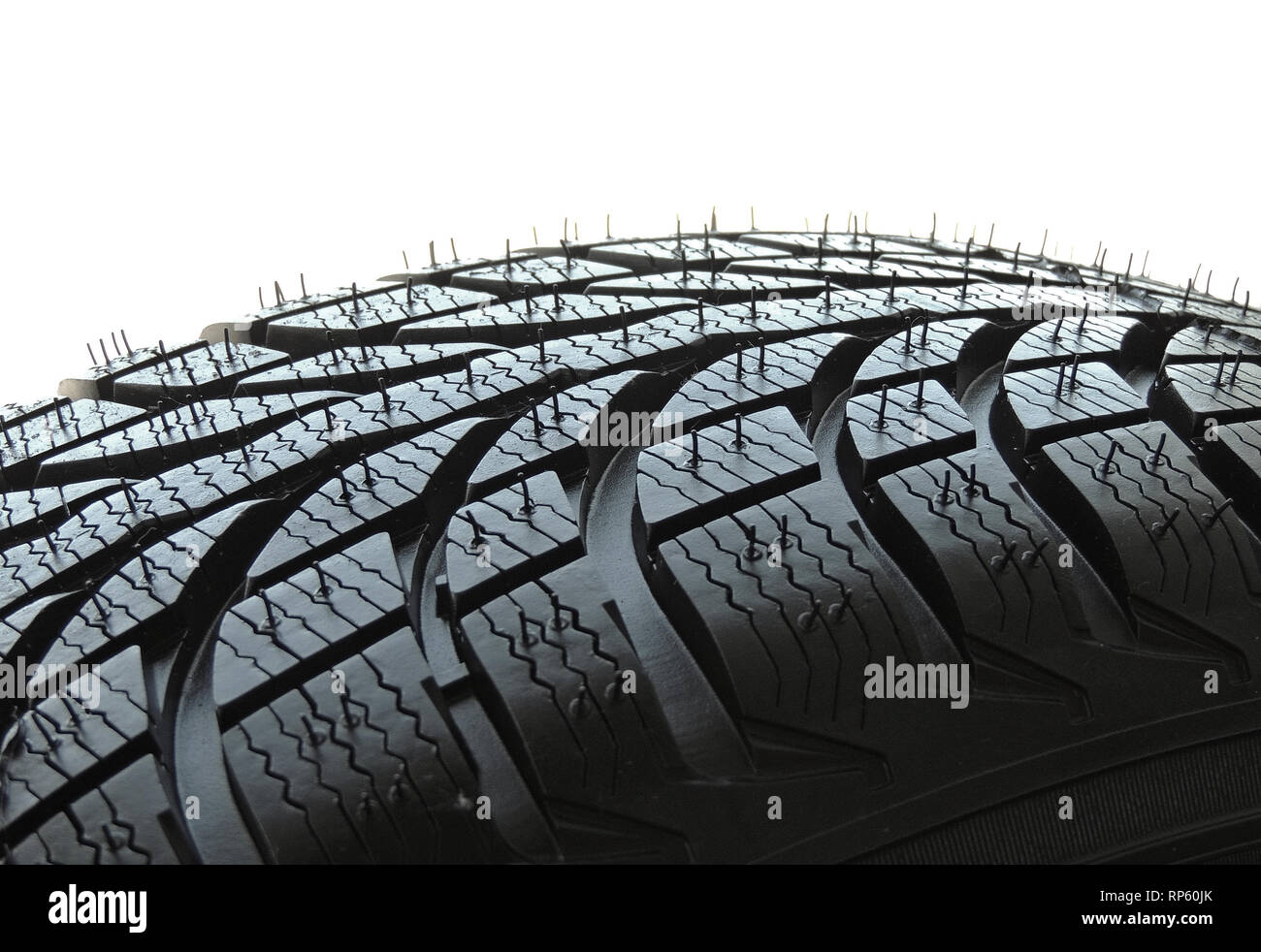 Rubber surface of new car tire with sipes and grooves close up Stock ...