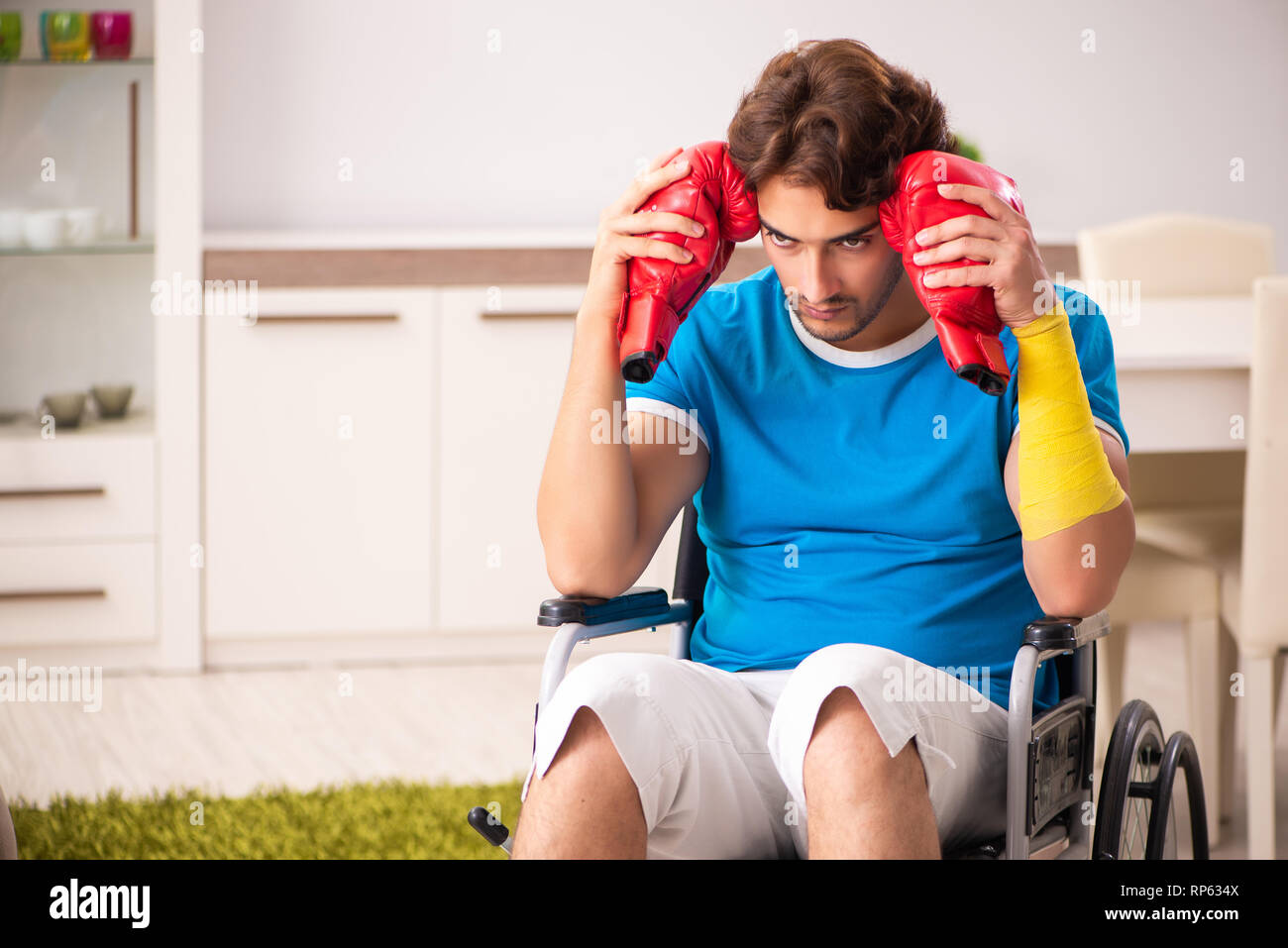 Injured man recovering from his injury Stock Photo - Alamy