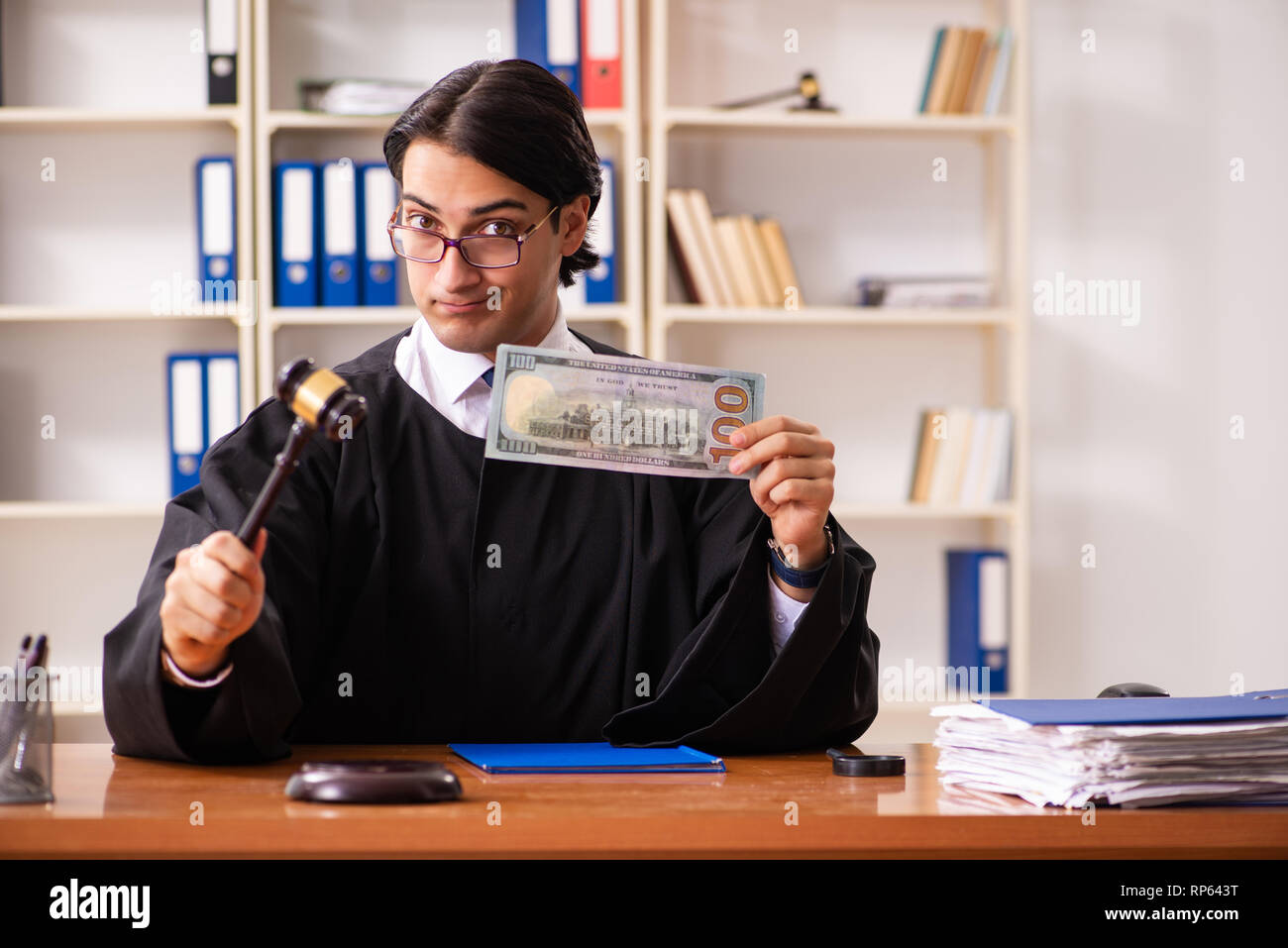 Young handsome judge working in court Stock Photo - Alamy