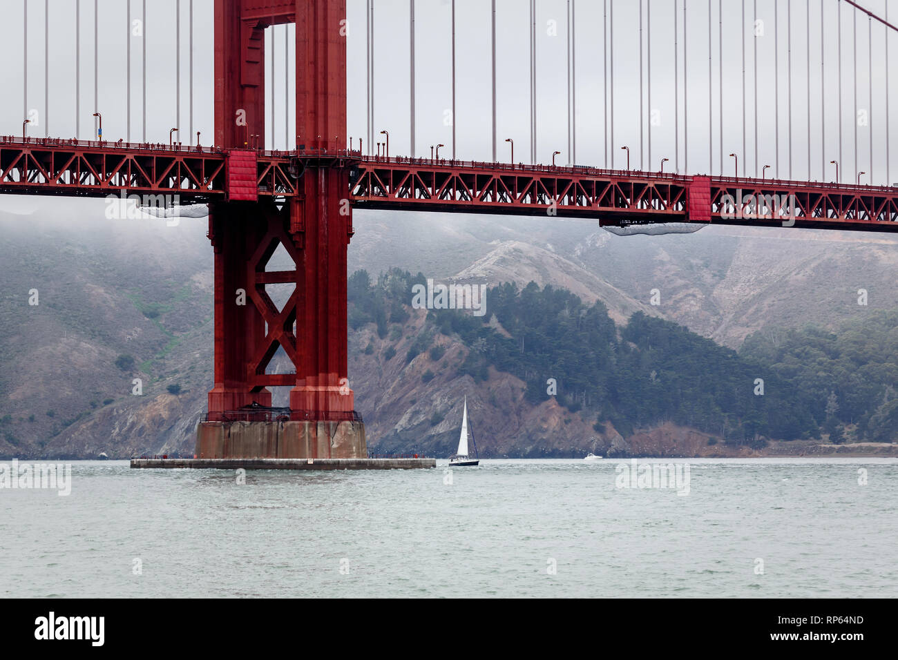 Closeup water level view of bottom tower of Golden Gate Bridge with ...