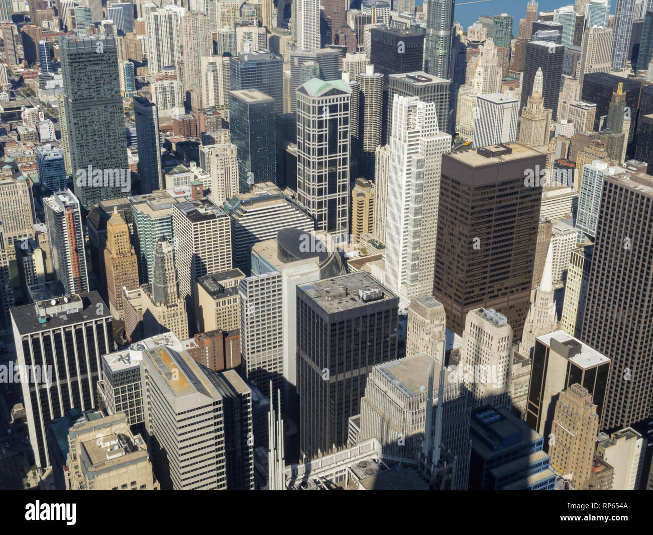 Aerial view of the top of hundreds of crowded city buildings in Chicago ...