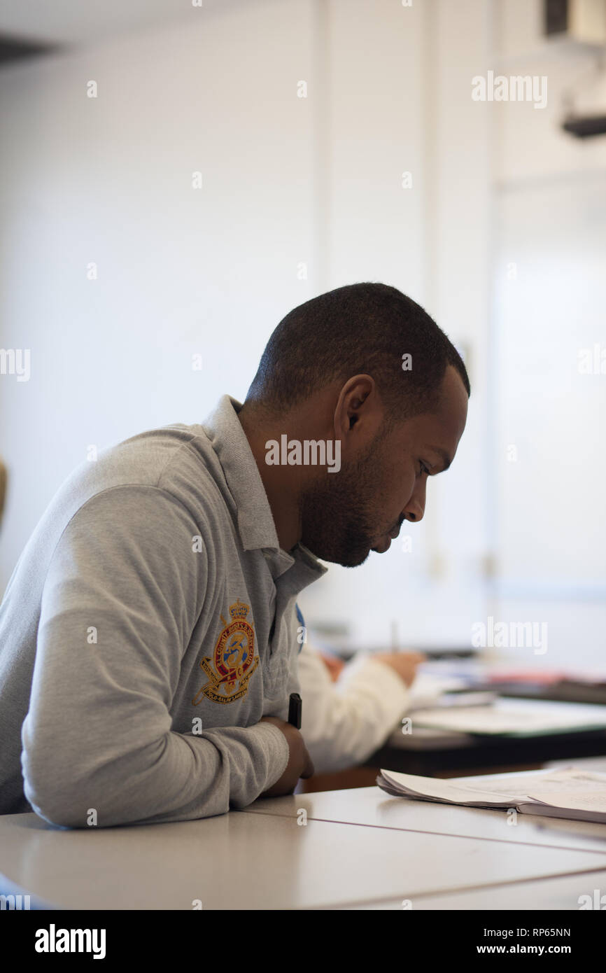 man in classroom studying ESOL, English for speakers of other languages ...