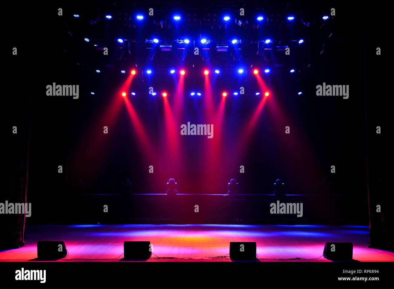 Free stage with lights, lighting devices. Night show Stock Photo - Alamy