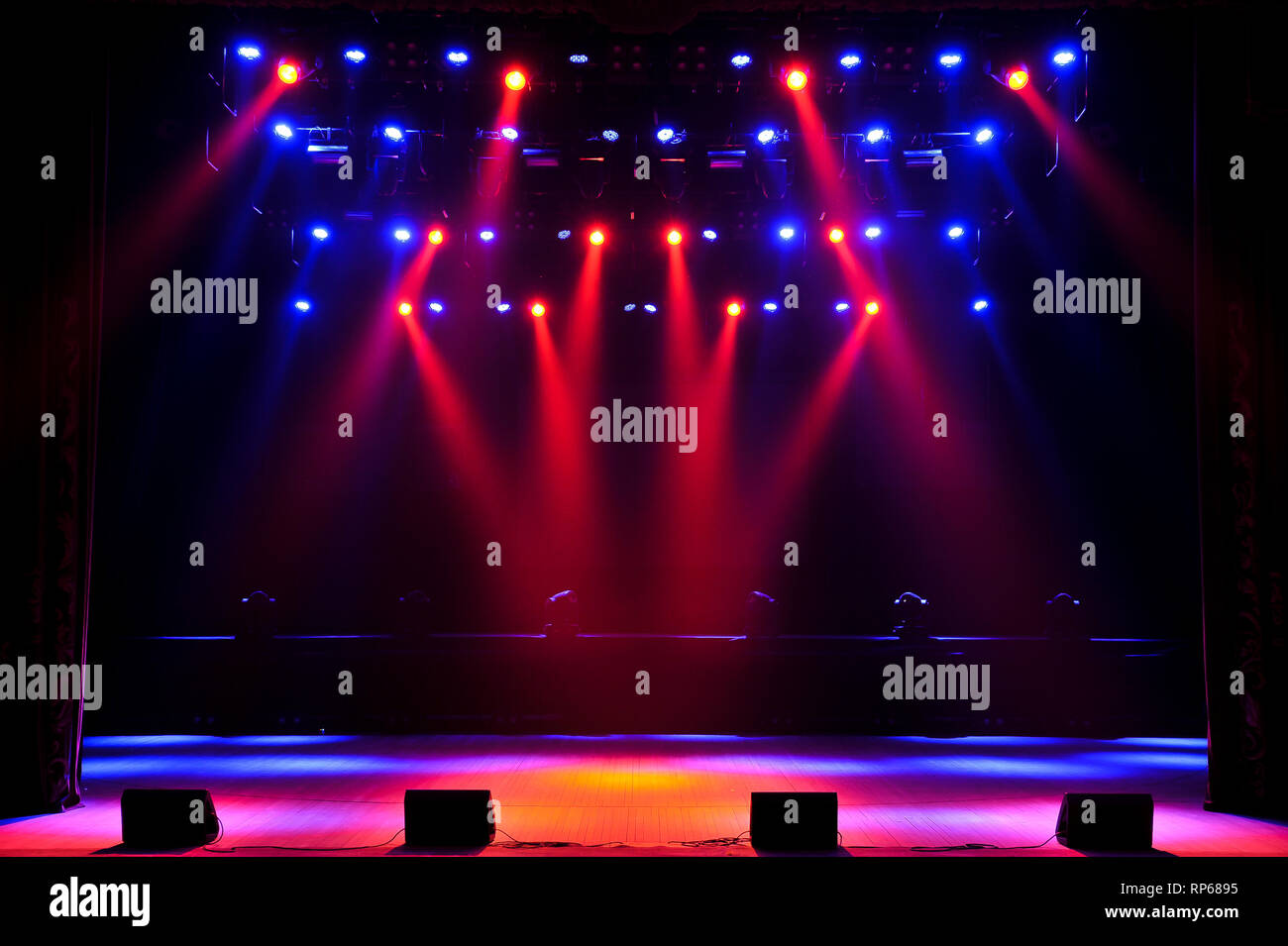 Free stage with lights, lighting devices. Night show Stock Photo - Alamy