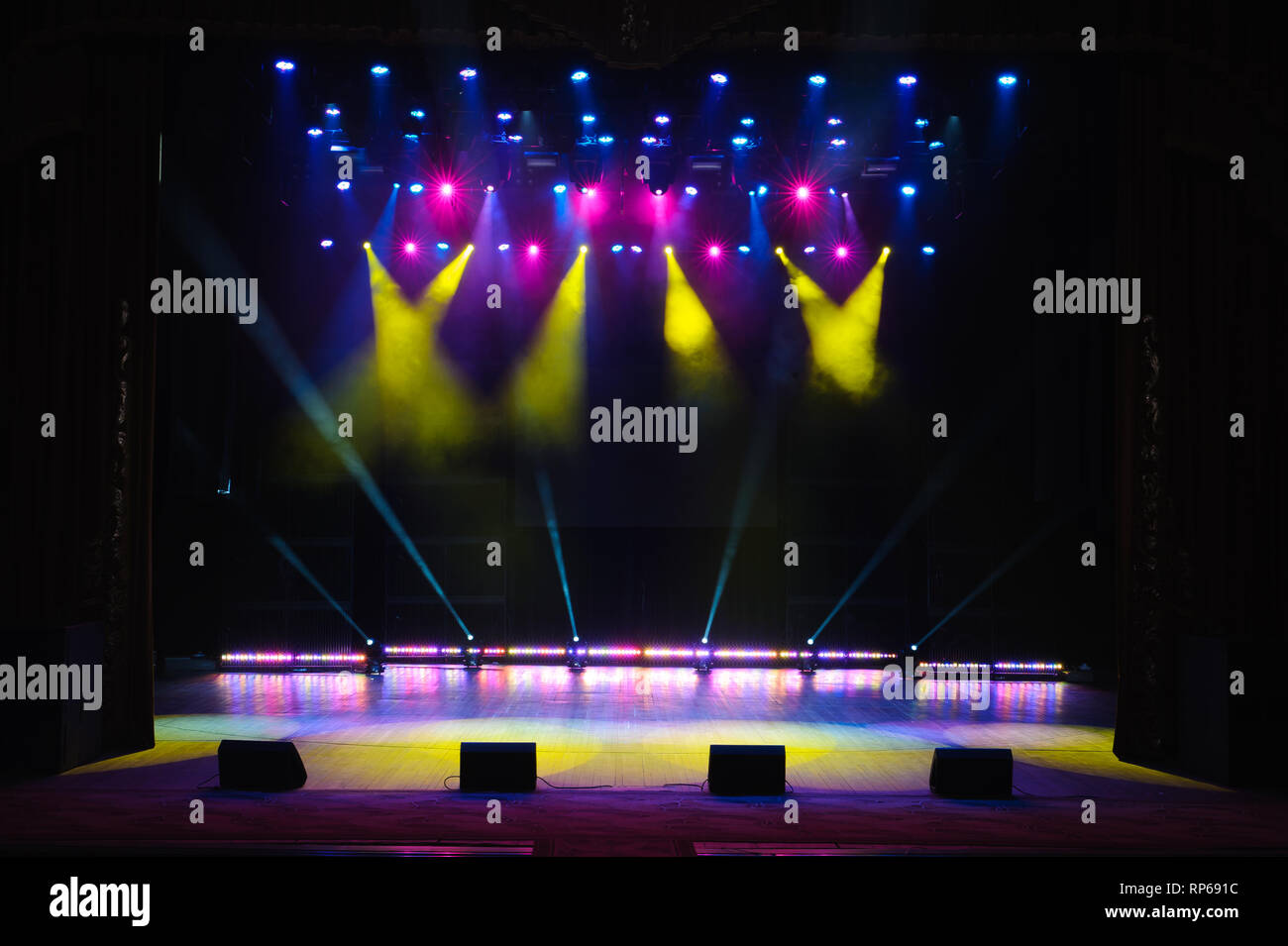 Free stage with lights, lighting devices. Night show Stock Photo - Alamy