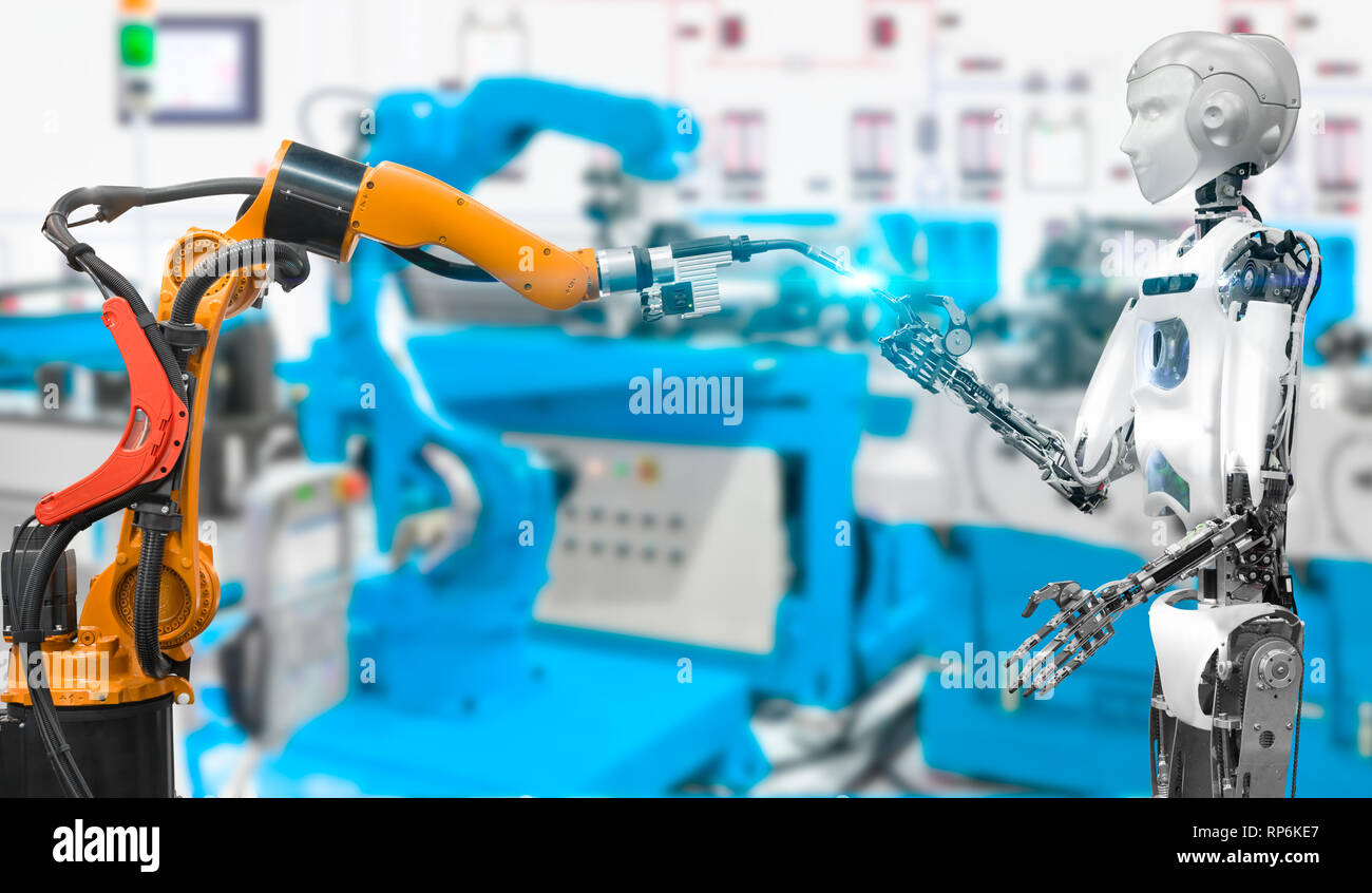 Humanoid robot with welding robot in an industrial of smart factory ...