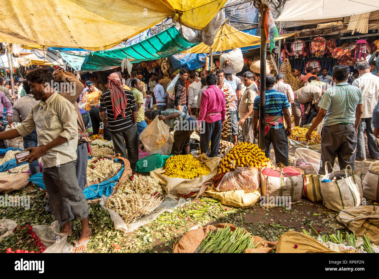 Crowds of local people sellers and buyers showing the hustle and bustle ...