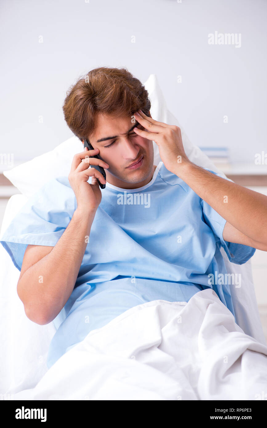 Young male patient lying on couch in hospital Stock Photo - Alamy