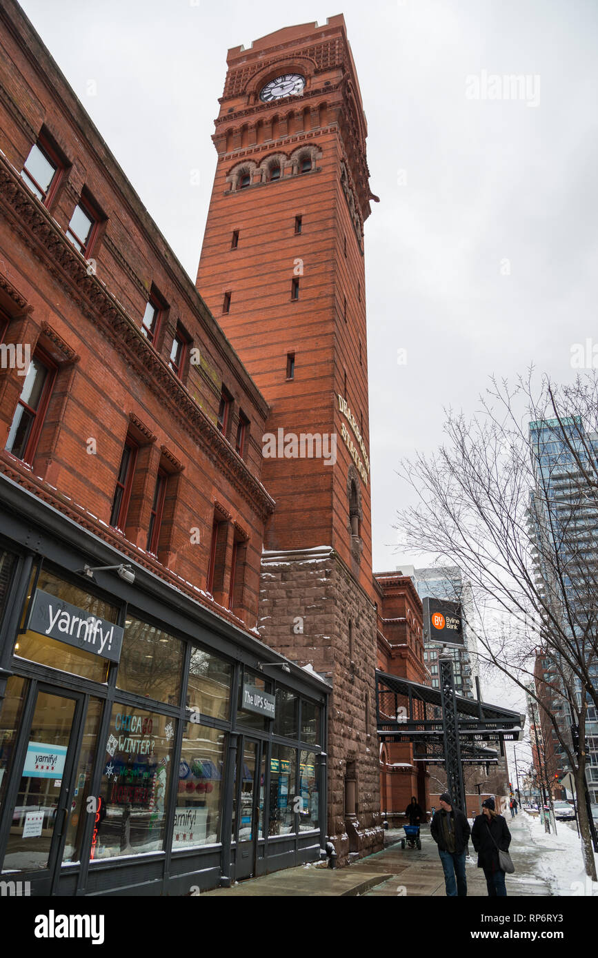 The clock tower on the Dearborn Station, a signature red brick building ...