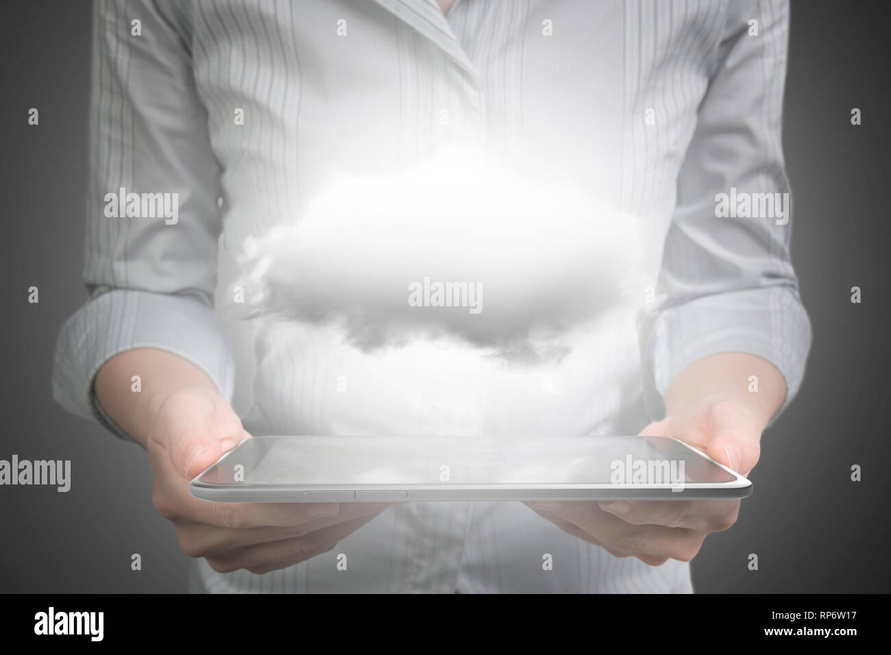Female hands holding smart tablet with white cloud Stock Photo - Alamy