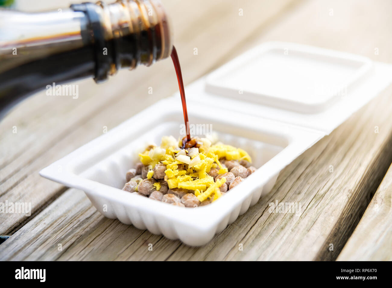 Closeup of Asian Japanese natto fermented soy dish meal in styrofoam ...