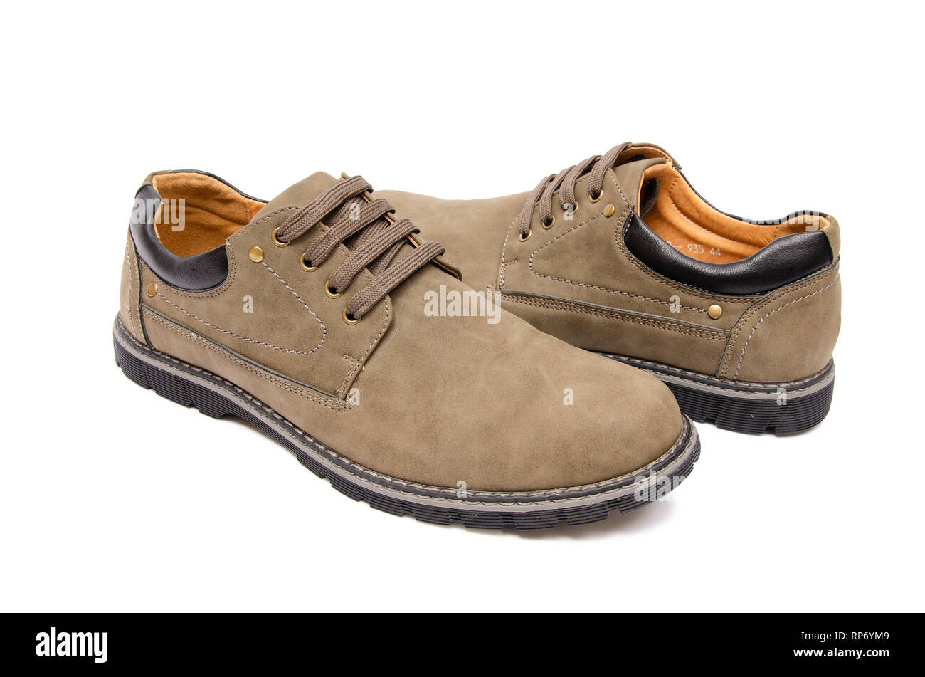 Brown suade shoes isolated on white background Stock Photo - Alamy