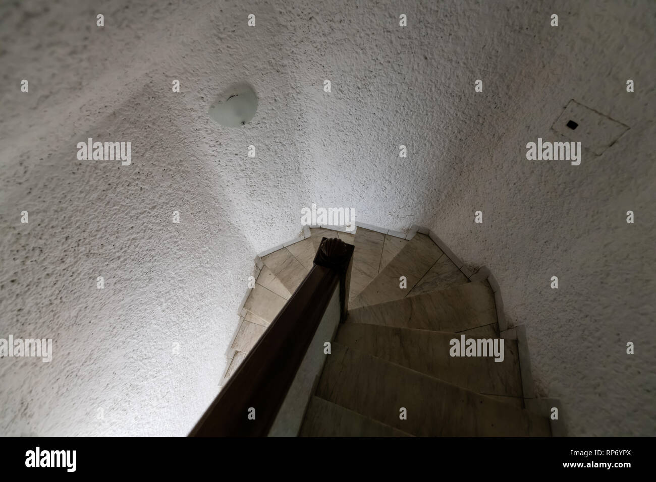 High angle view looking down of old vintage stone basement cave winding ...