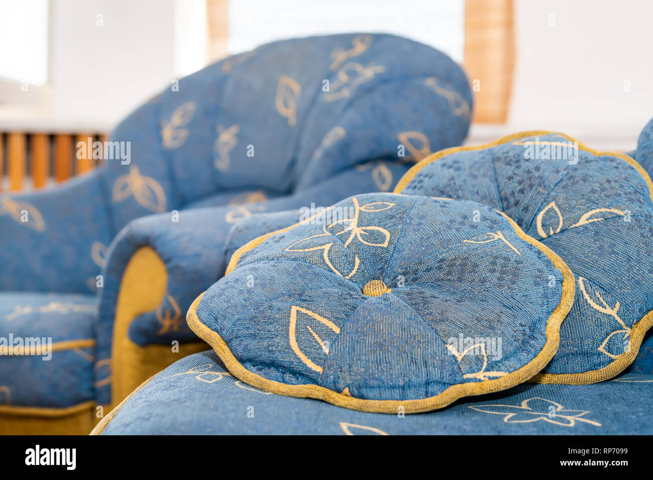 Closeup of empty old antique retro vintage blue couch sofa with ...