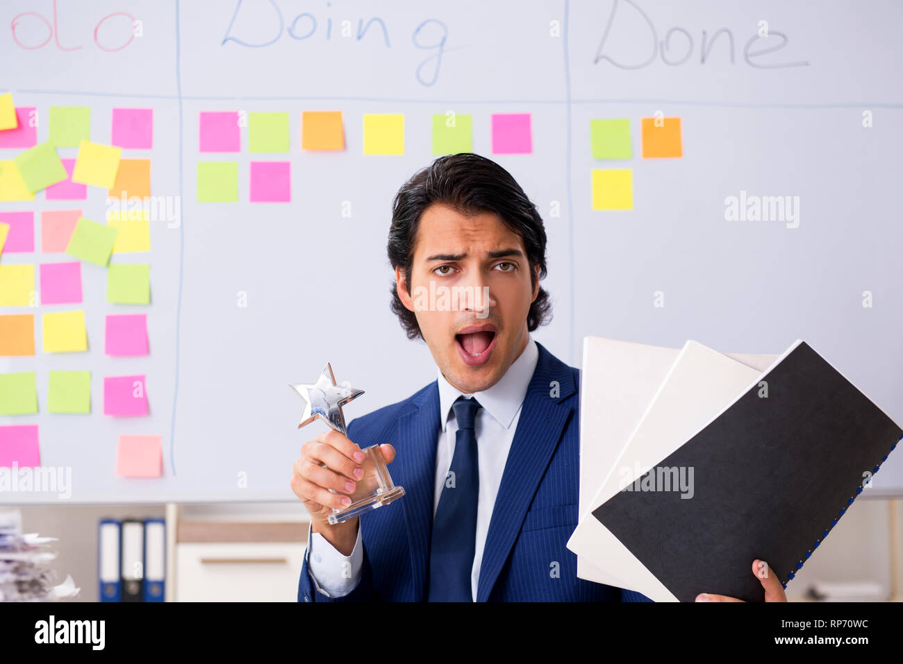 Young handsome employee in front of whiteboard with to-do list Stock ...