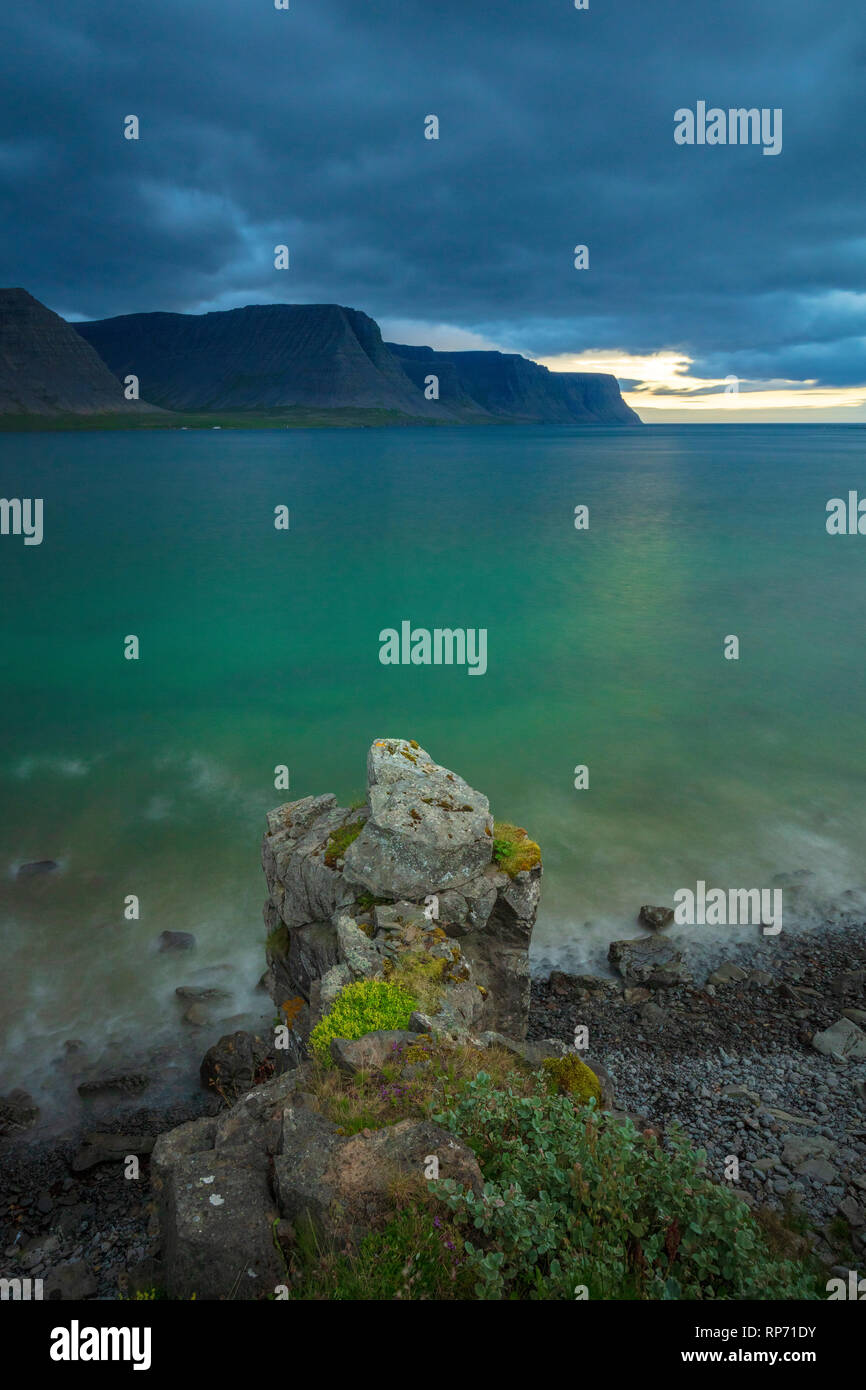 Coastal view across Patreksfjordur fjord to the Latrabjarg Peninsula ...