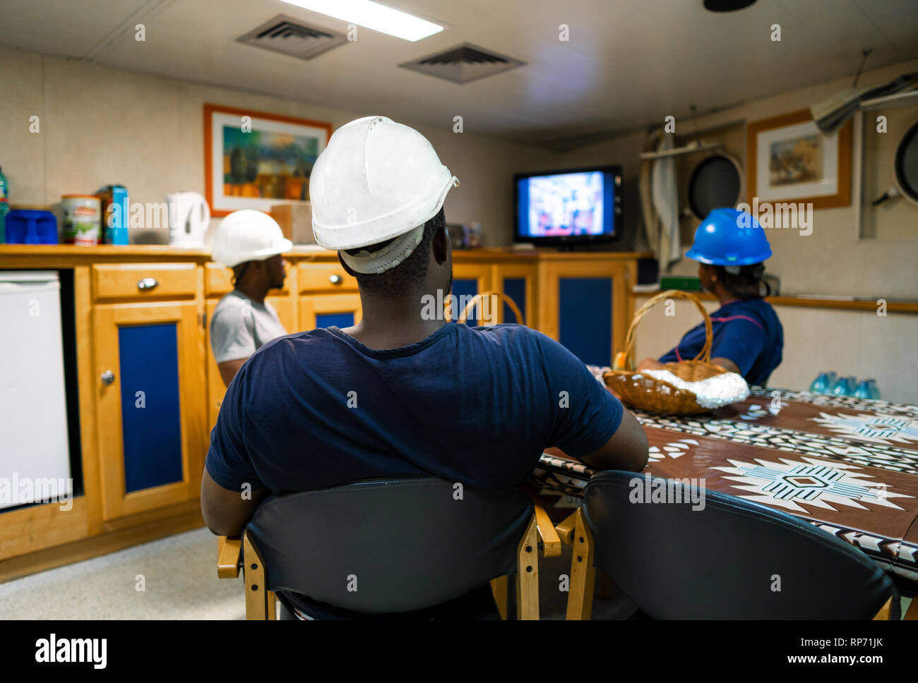 Seamen crew onboard a ship or vessel having fun watching TV Stock Photo ...