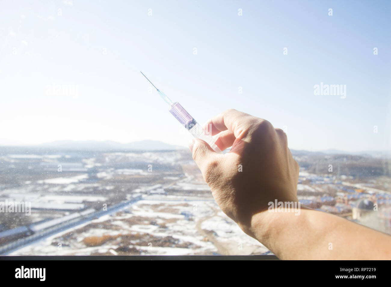 Syringe and arm Stock Photo - Alamy