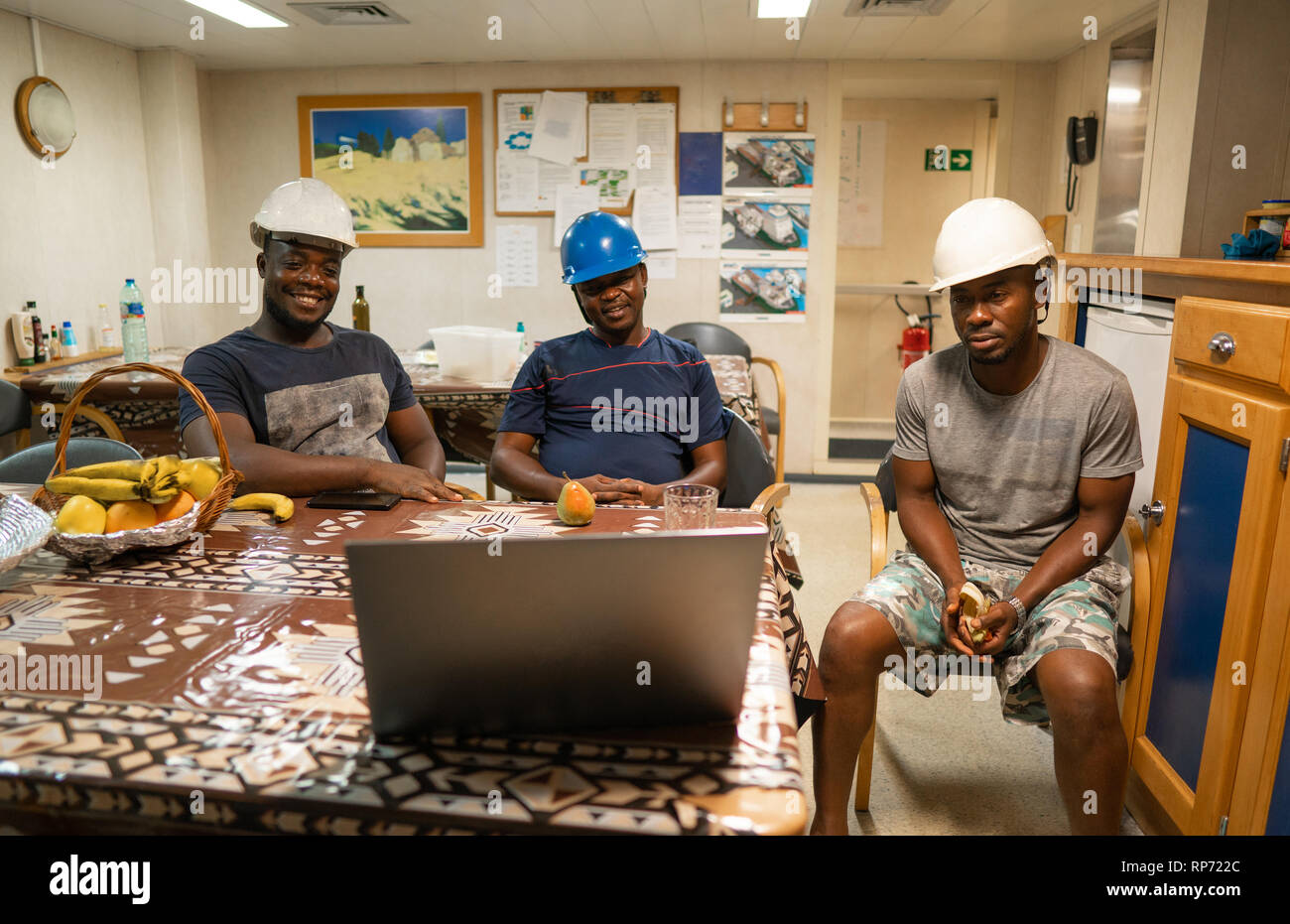 Seamen crew onboard a ship or vessel having fun watching movie Stock ...