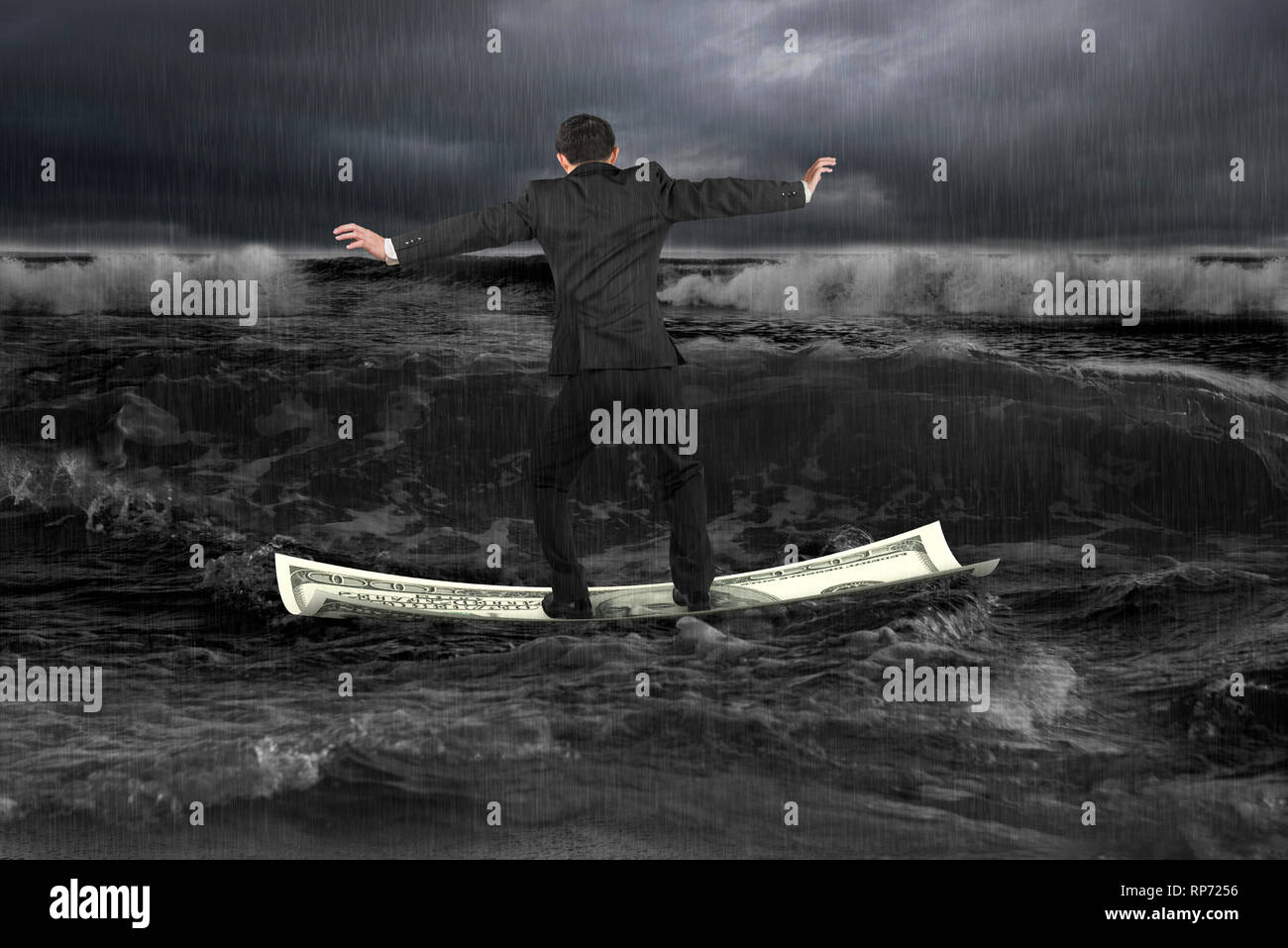 Businessman balancing and standing on money boat floating in dark ocean ...
