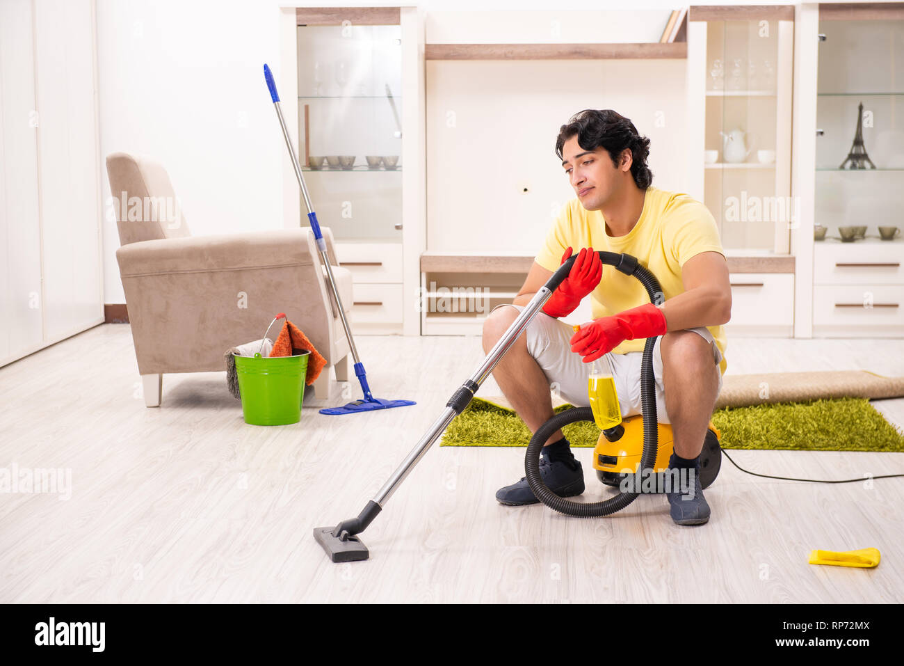 Frustrated man doing housework hi-res stock photography and images - Alamy