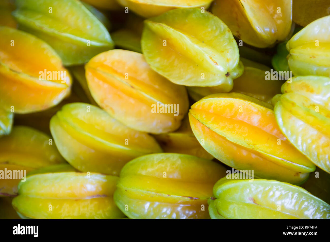 Pile of fresh ripe yellow carambola star fruits on display at a ...
