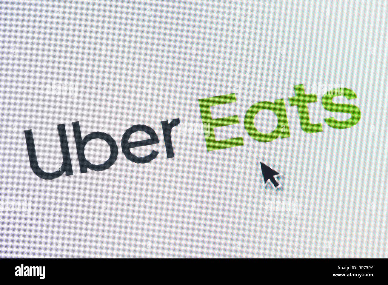The logo of Uber Eats is seen on a computer screen along with a mouse ...