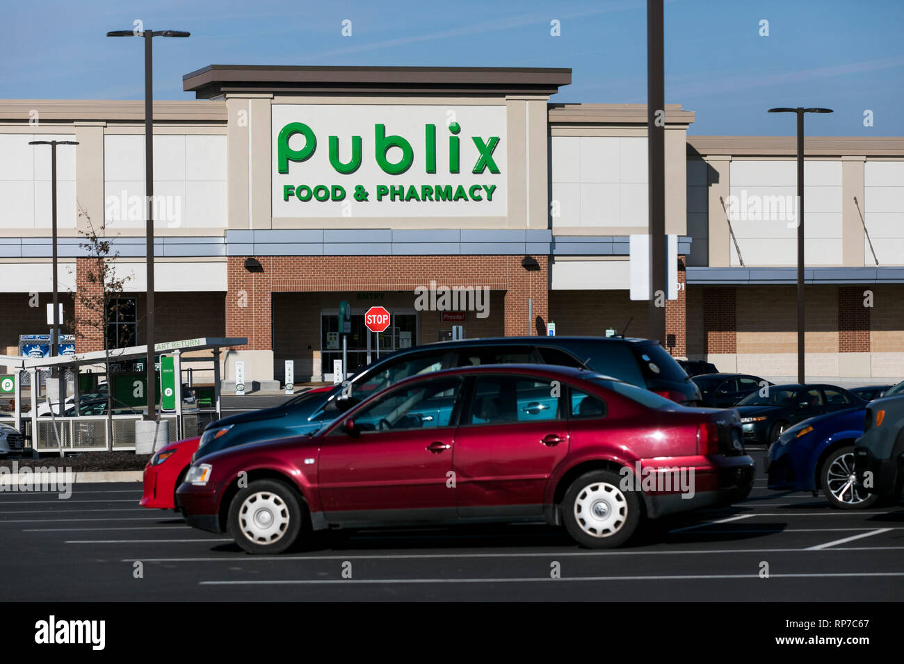 A logo sign outside of a Publix grocery store location in ...