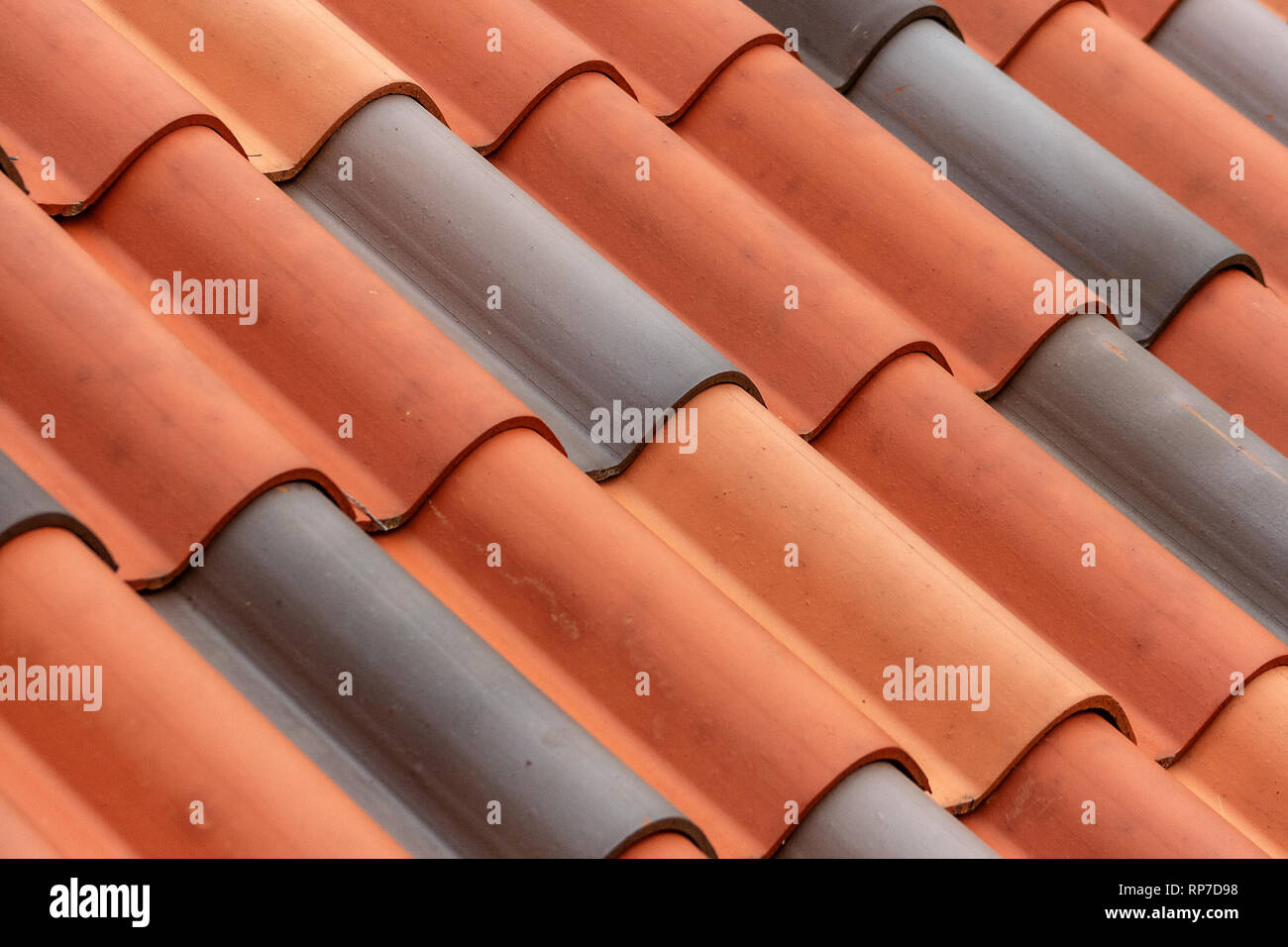 Multi colored clay tile roof Stock Photo - Alamy