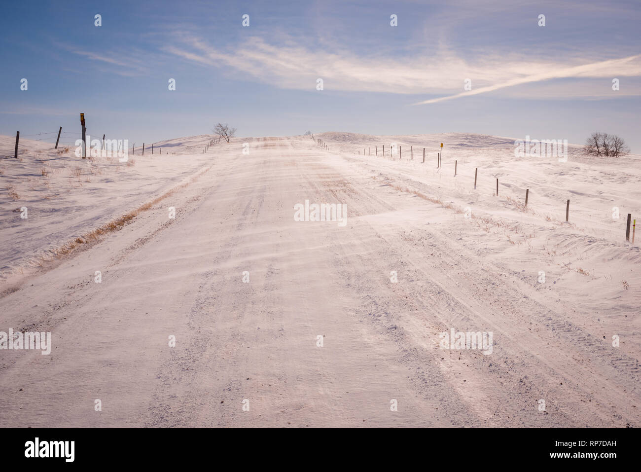 Snow blowing over gravel road in a Saskatchewan winter Stock Photo - Alamy