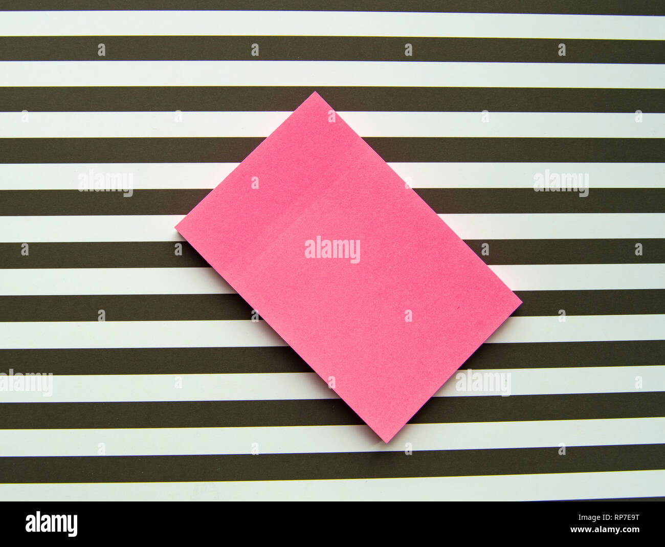 Red message sticker on black and white striped background, business ...