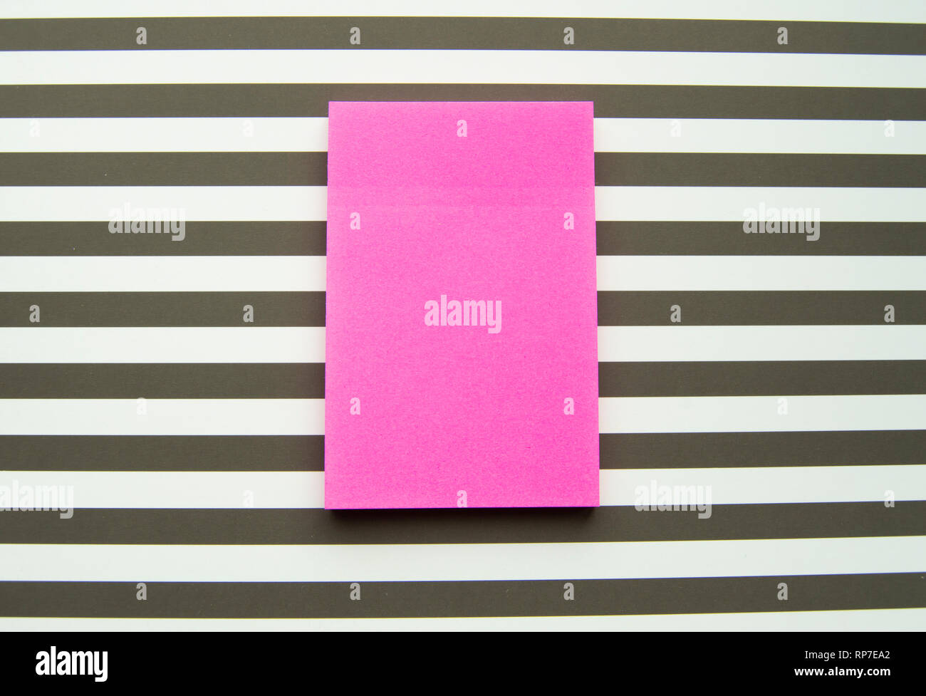 Red message sticker on black and white striped background, business ...