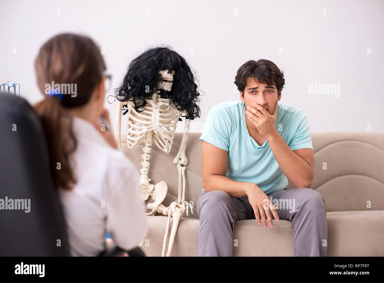 Young patient visiting psychologist for therapy Stock Photo - Alamy