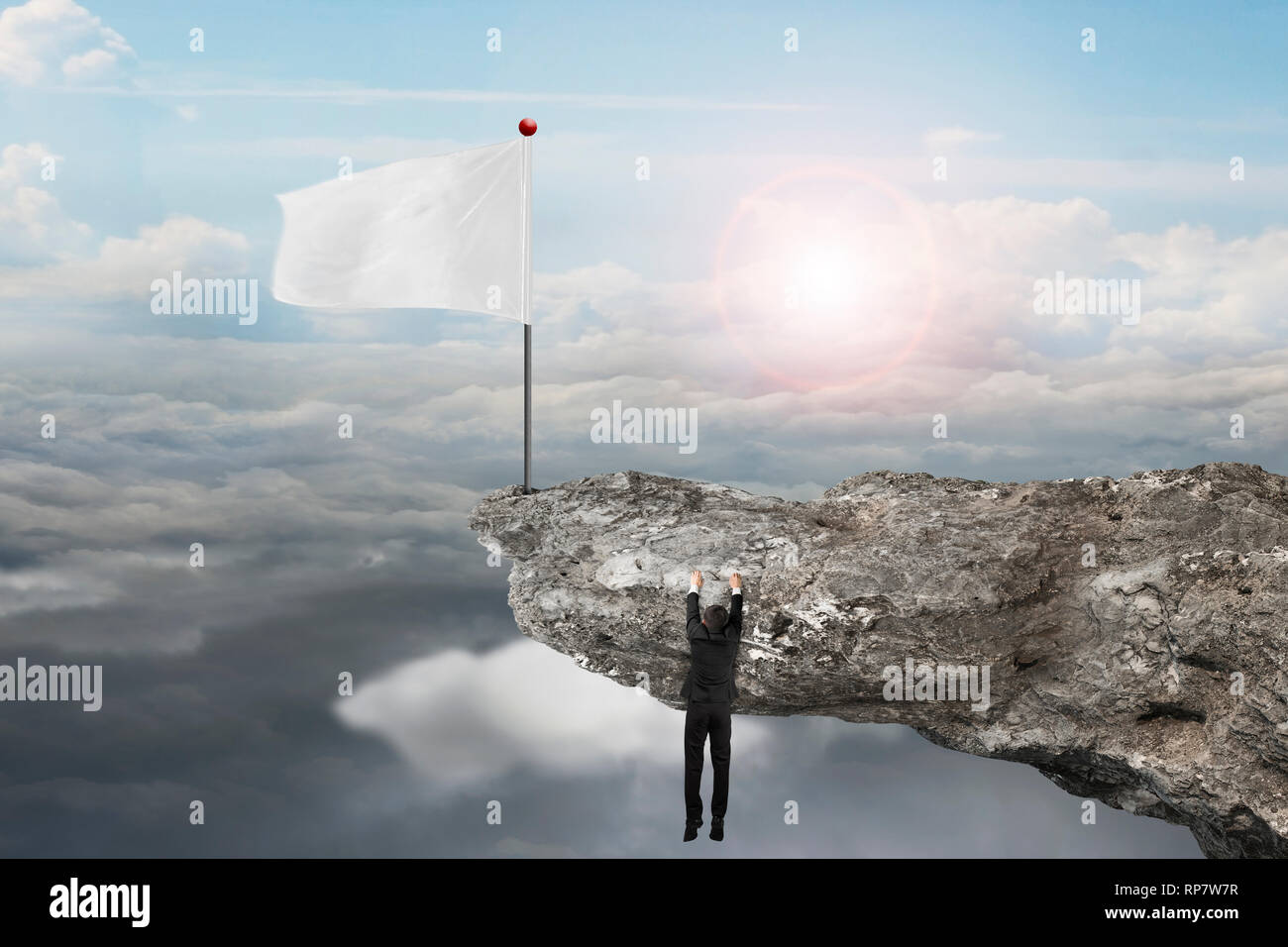 Man hanging on cliff hi-res stock photography and images - Alamy