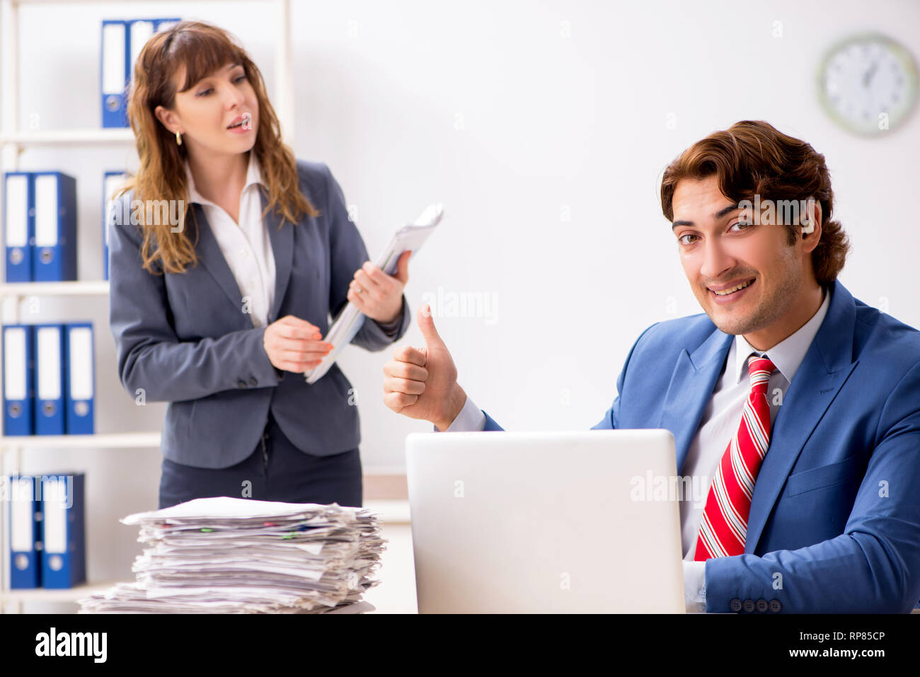 Deaf employee using hearing aid talking to boss Stock Photo - Alamy