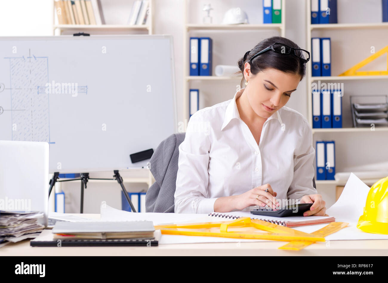 Female architect working in the office Stock Photo - Alamy