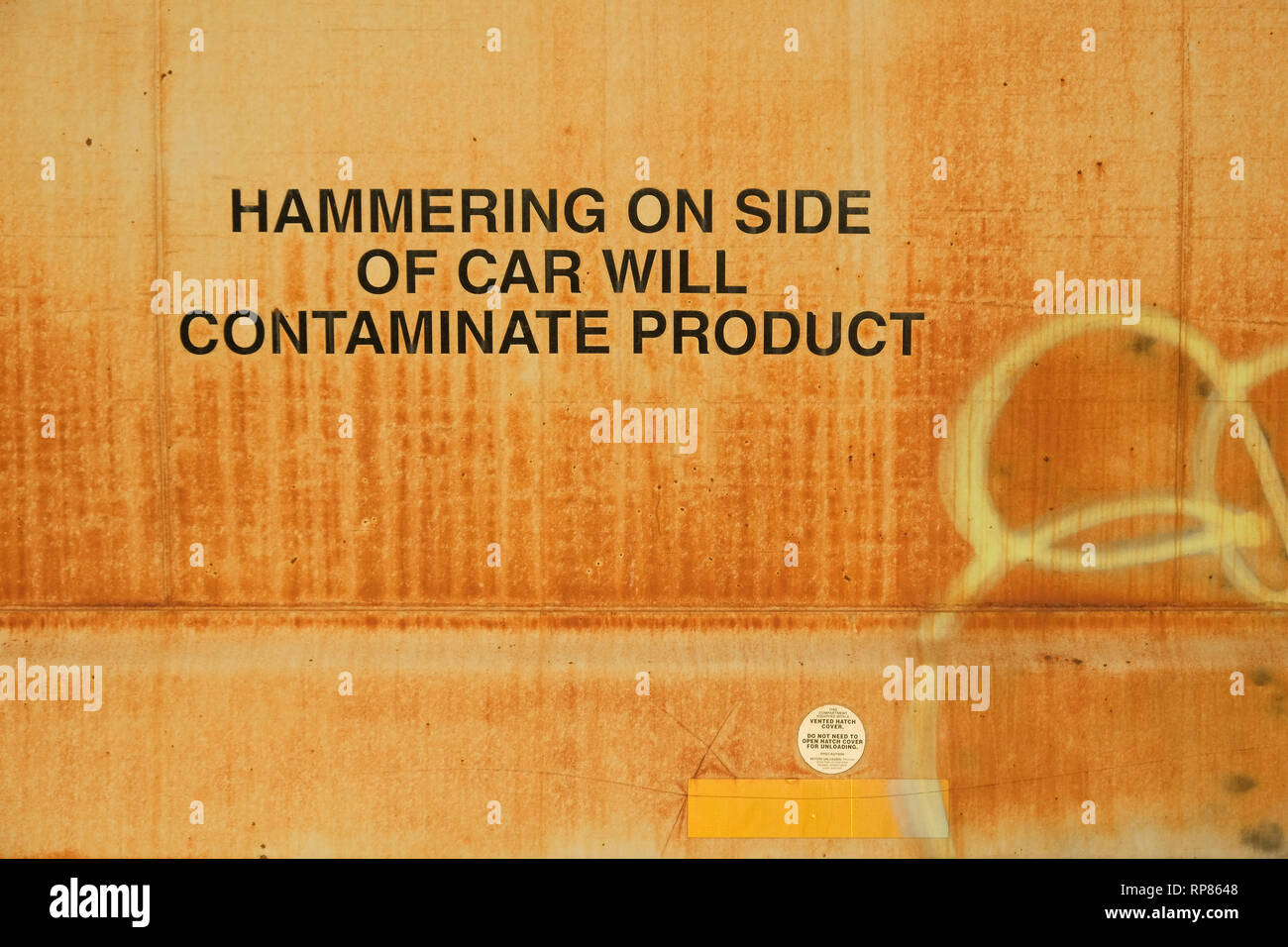Warning on side of chemical transport train: "Hammering on side of car ...