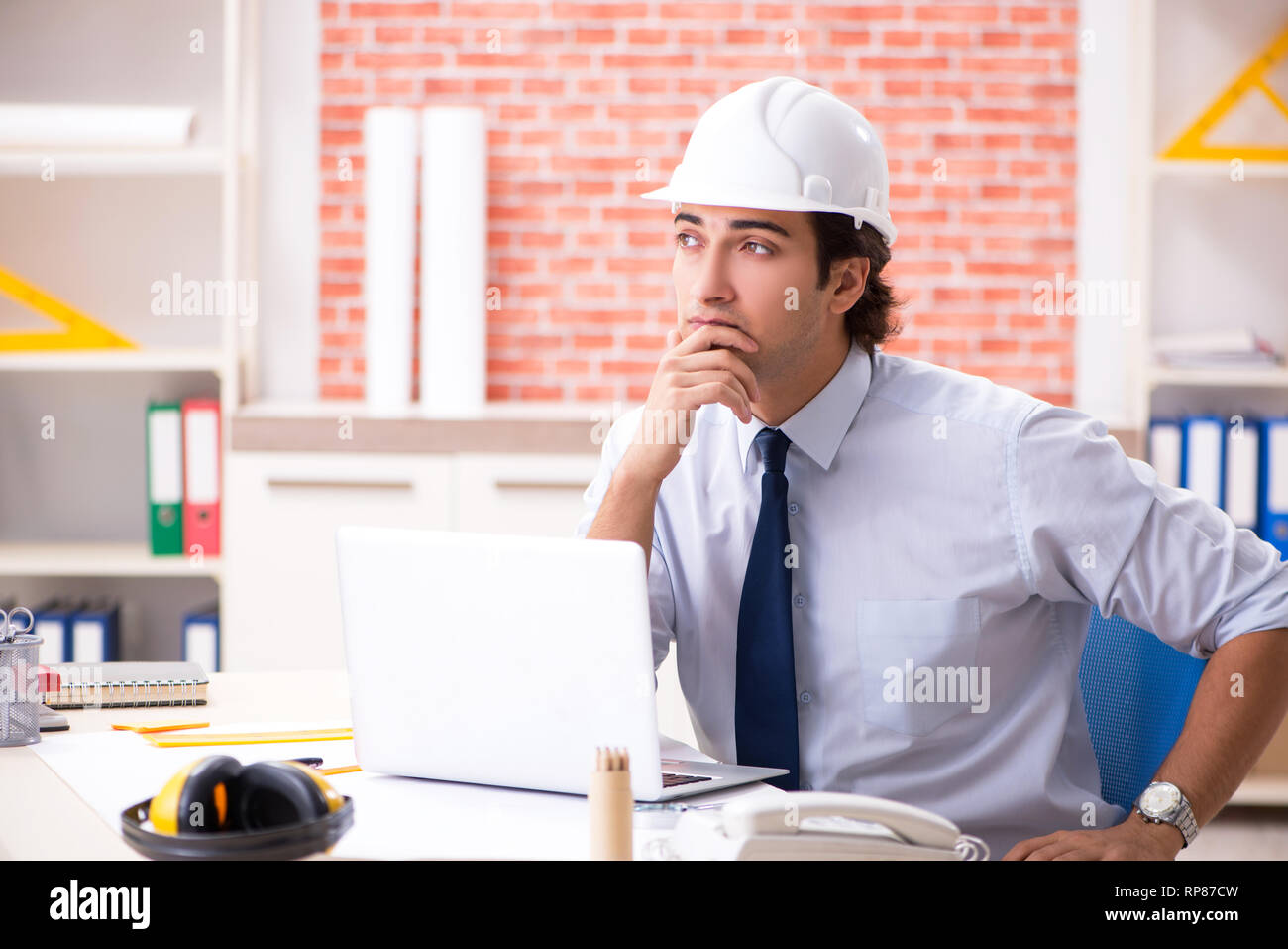 Construction supervisor working on blueprints Stock Photo - Alamy