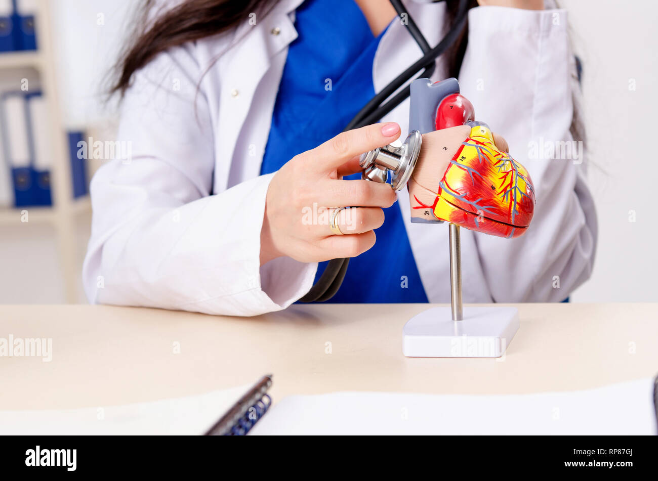 Female doctor cardiologist working in the clinic Stock Photo - Alamy