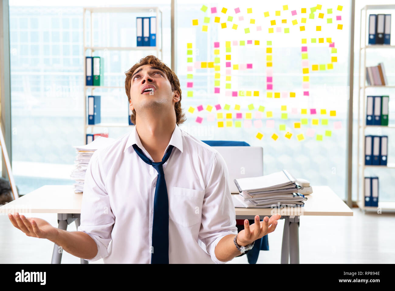 Busy businessman working in the office Stock Photo - Alamy