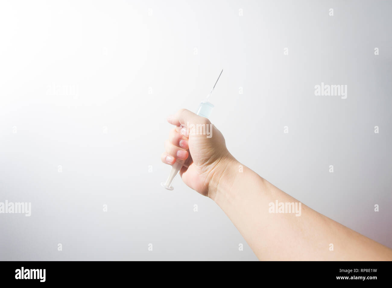 Syringe and arm Stock Photo - Alamy