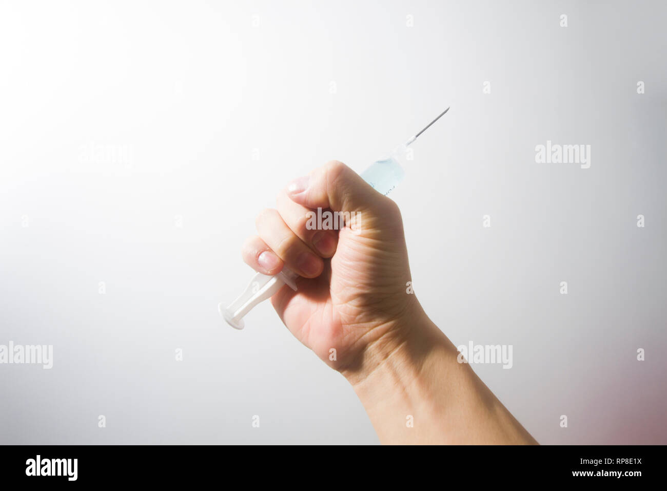 Syringe and arm Stock Photo - Alamy