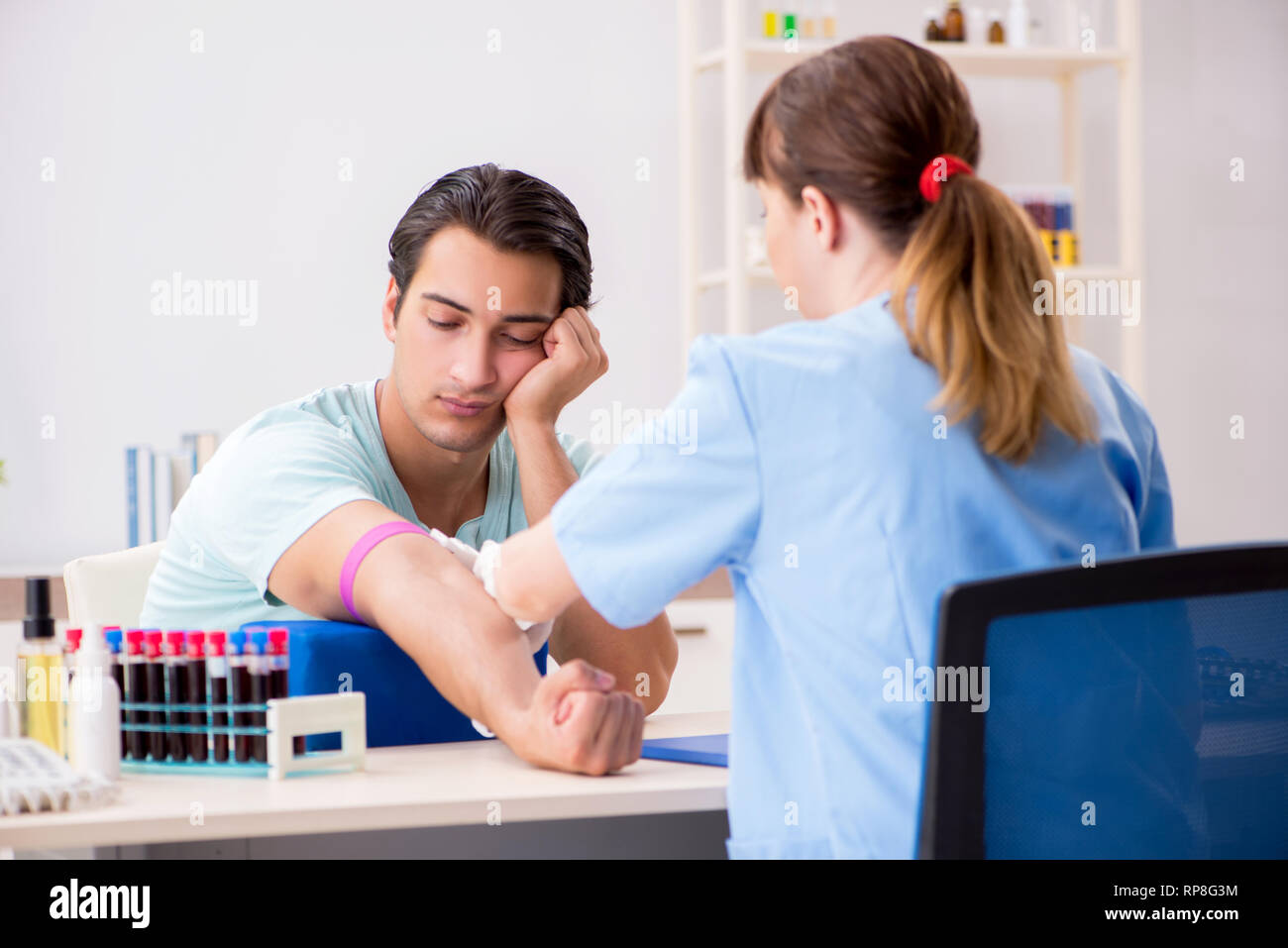 Young patient during blood test sampling procedure Stock Photo - Alamy