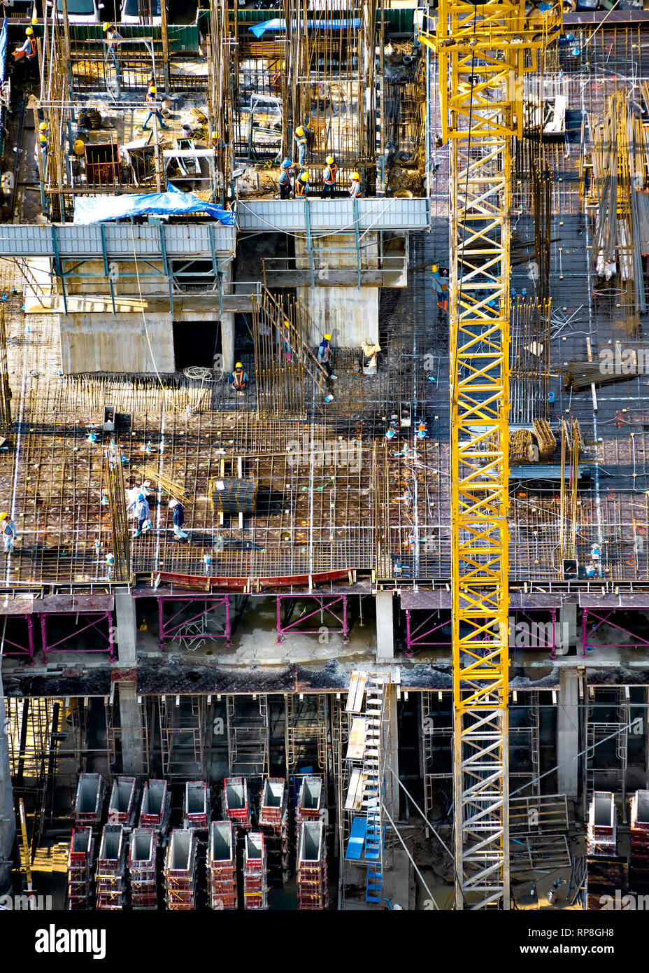 Aerial view of a building construction with tower crane, scaffolding ...