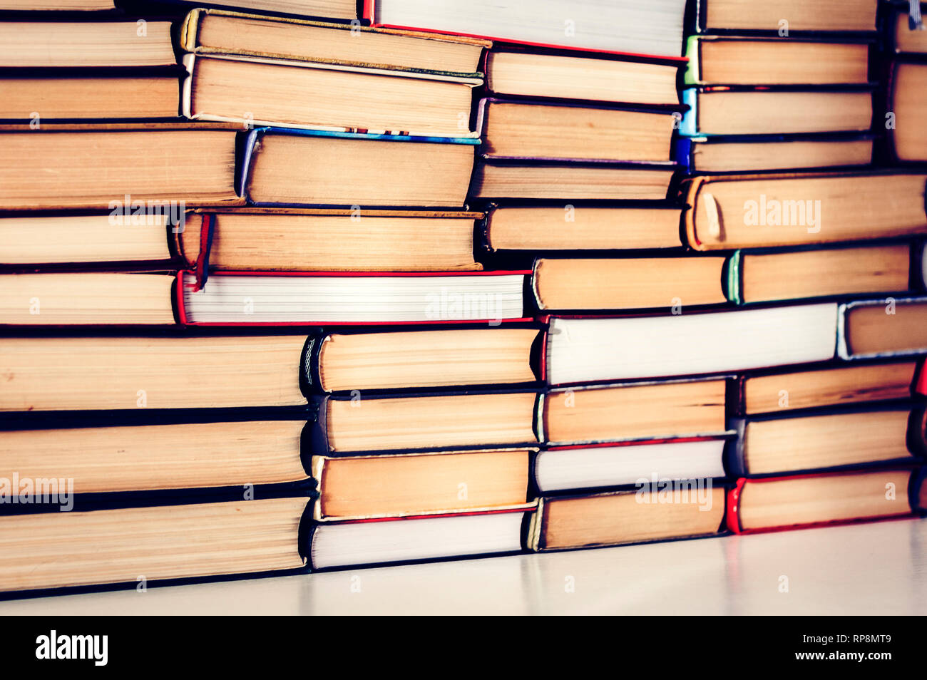 Stack of books education concept background, many books piles with copy ...