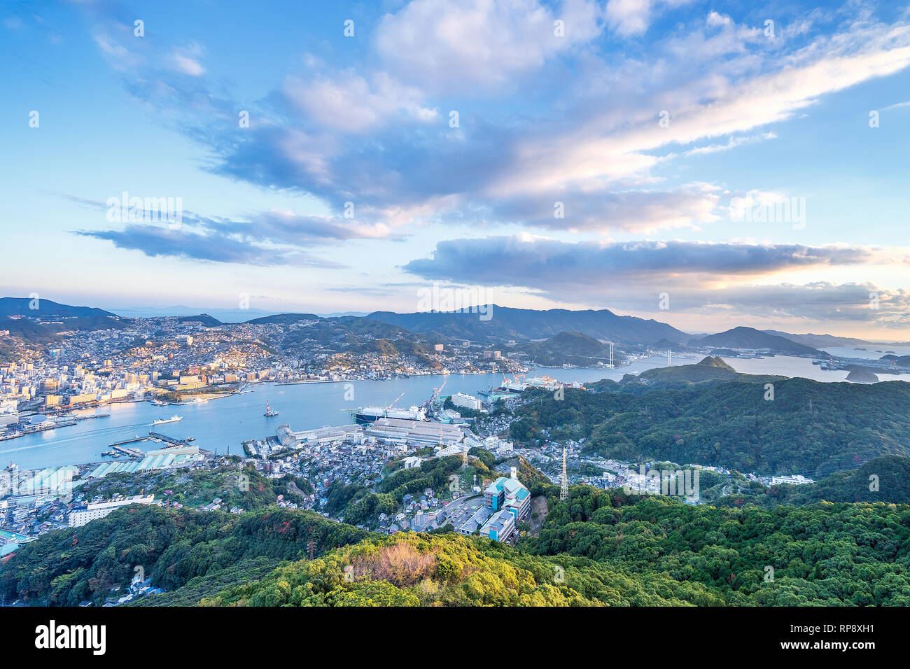 Business concept, modern cityscape of nagasaki dusk from mount inasa ...