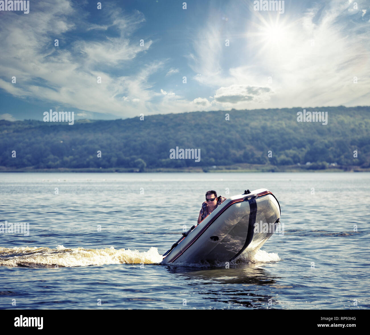 Man on rubber speedboat hi-res stock photography and images - Alamy